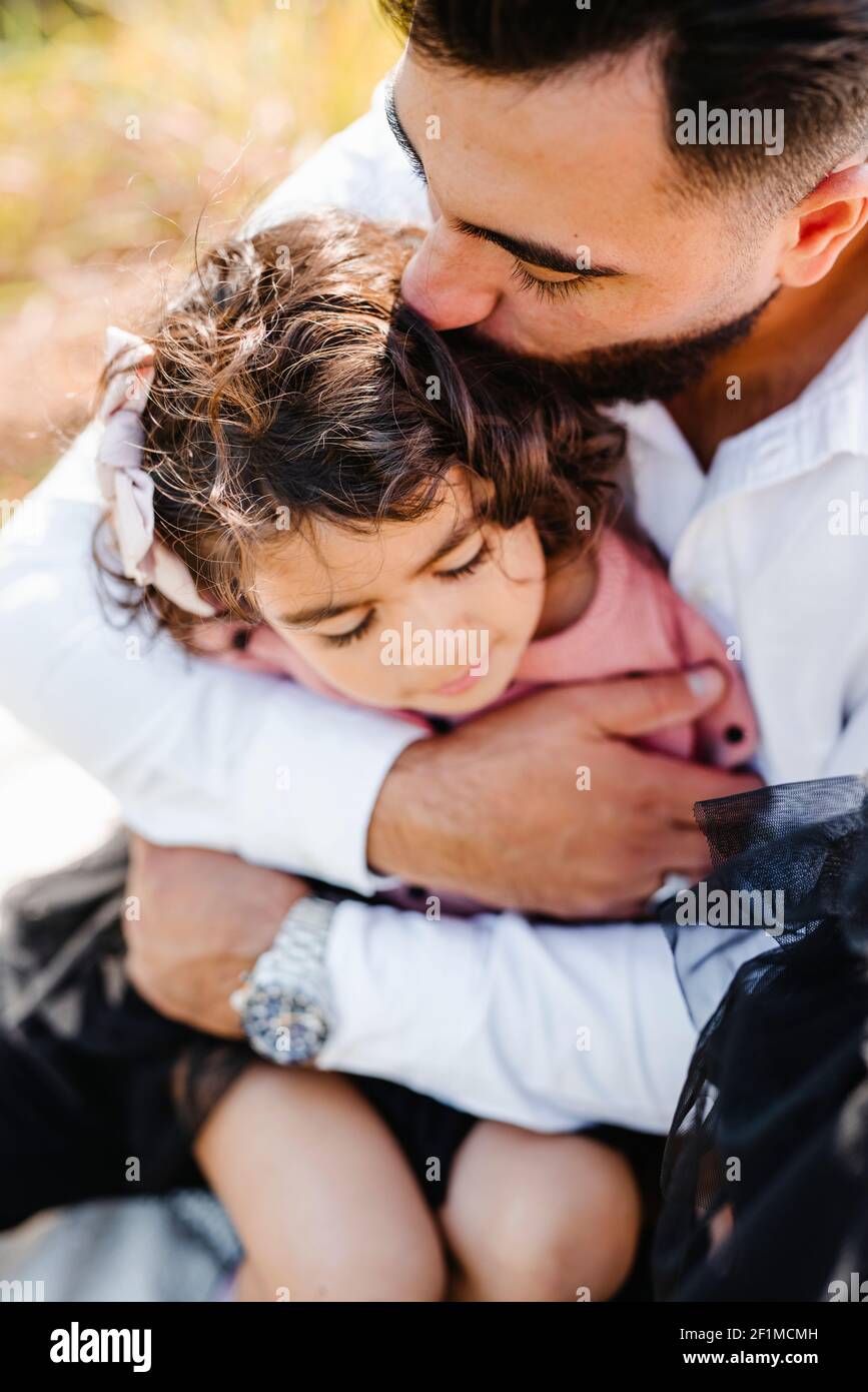 Father hugging daughter Stock Photo - Alamy