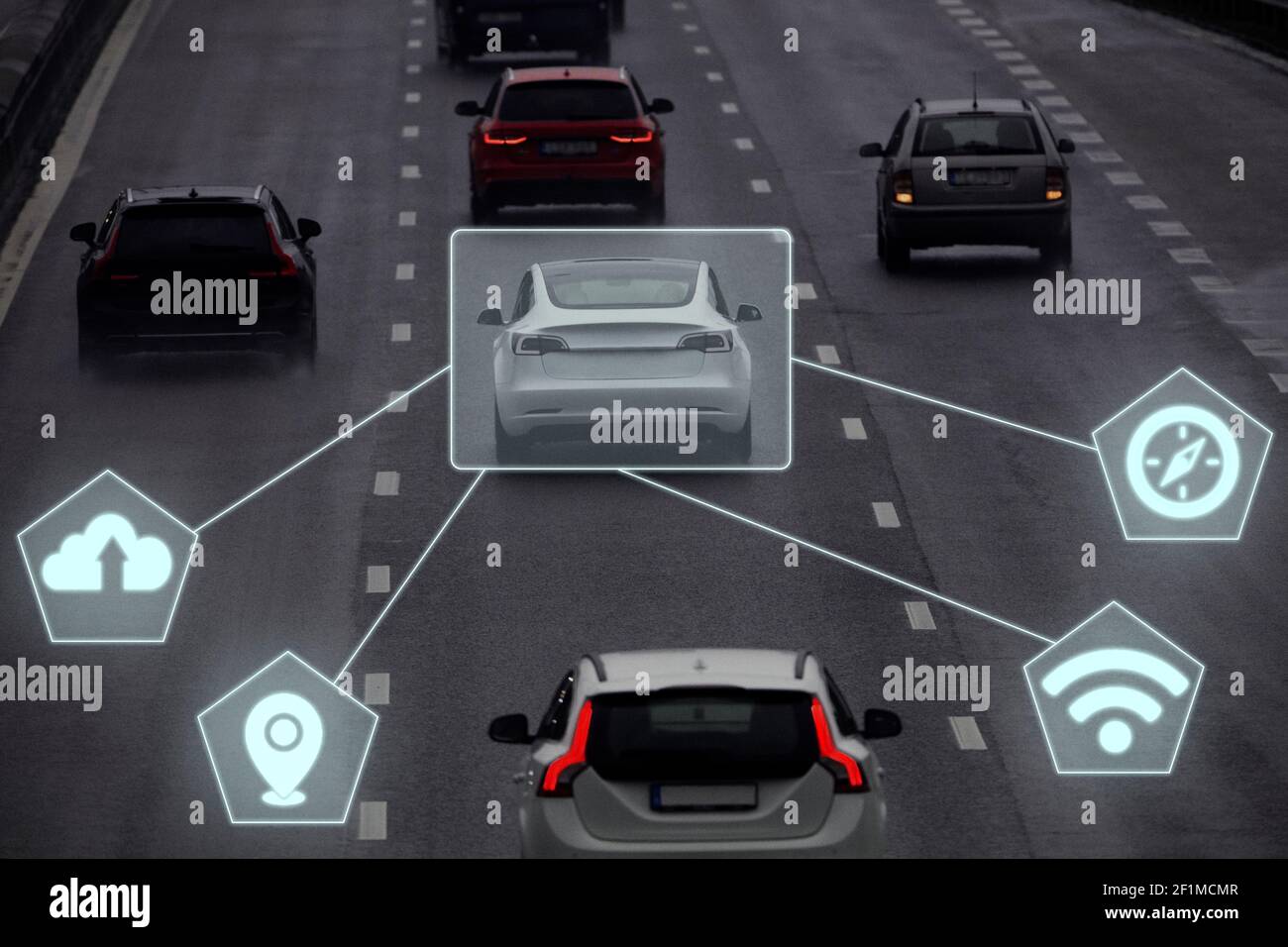 Cars on road with computer icons Stock Photo - Alamy