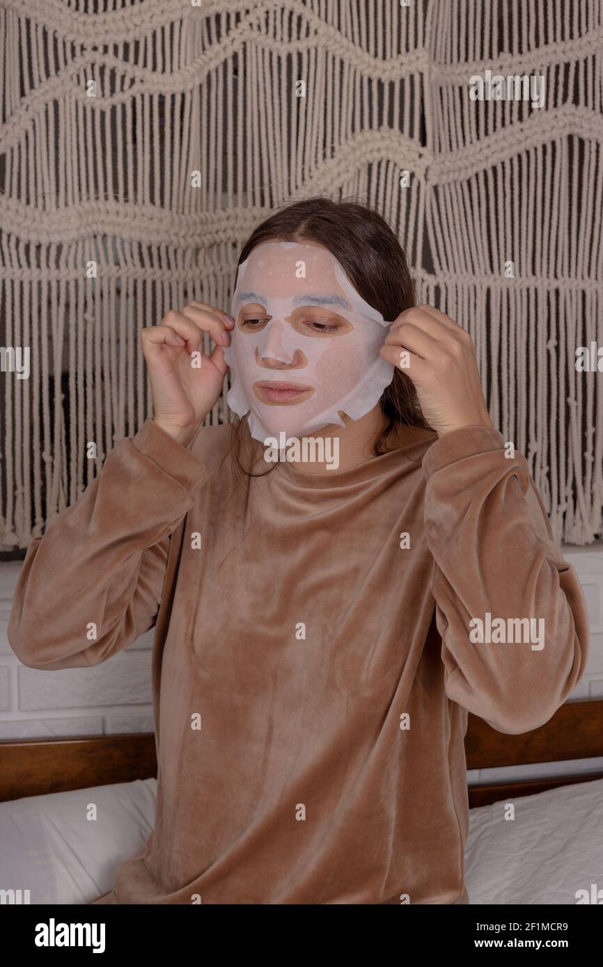 Woman apply mask self hi-res stock photography and images - Alamy