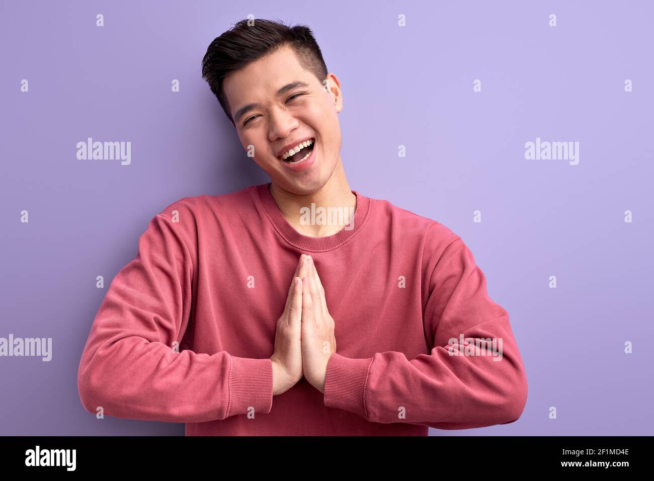 Positive asian guy keeping hi-res stock photography and images - Alamy