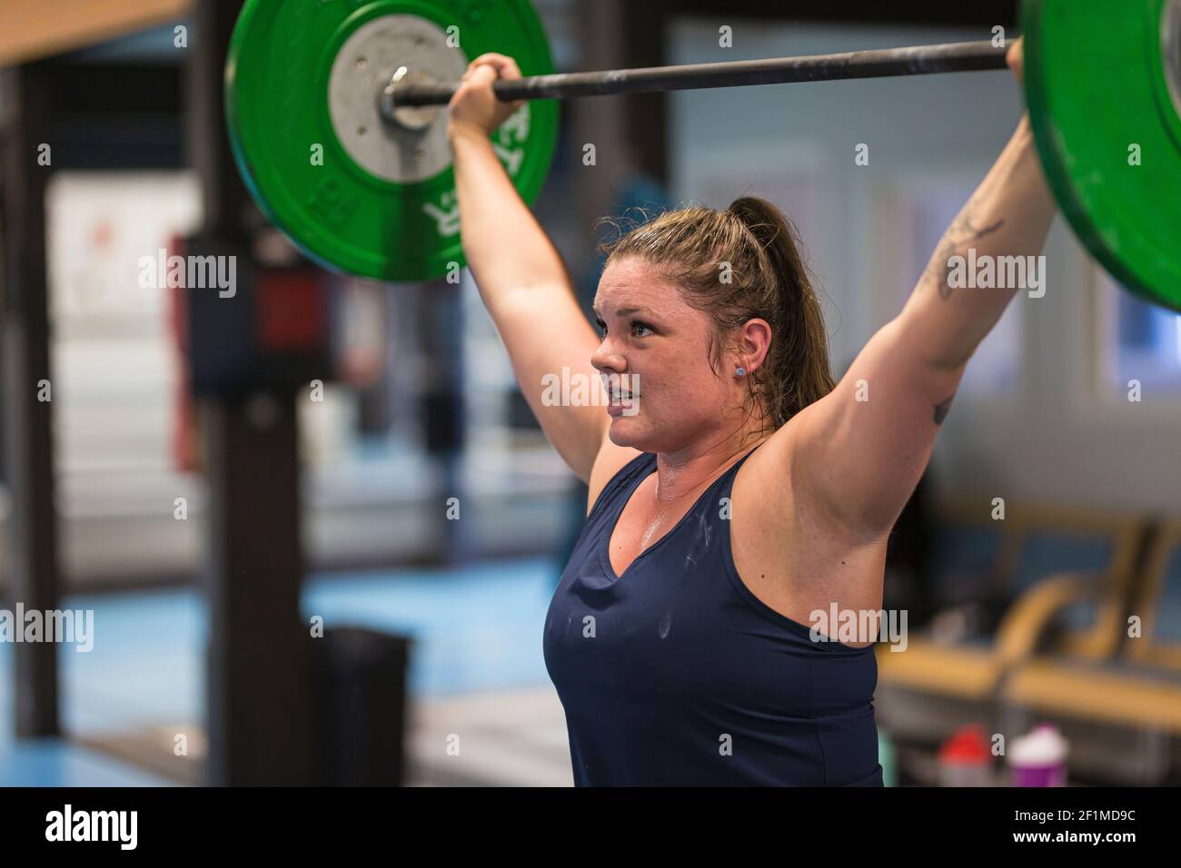 Woman weightlifting in gym Stock Photo - Alamy