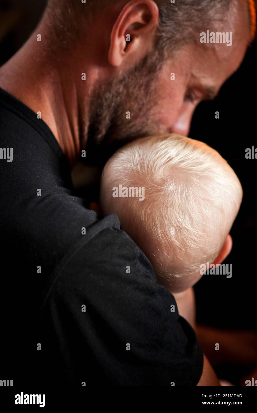 Father kissing babys head Stock Photo - Alamy