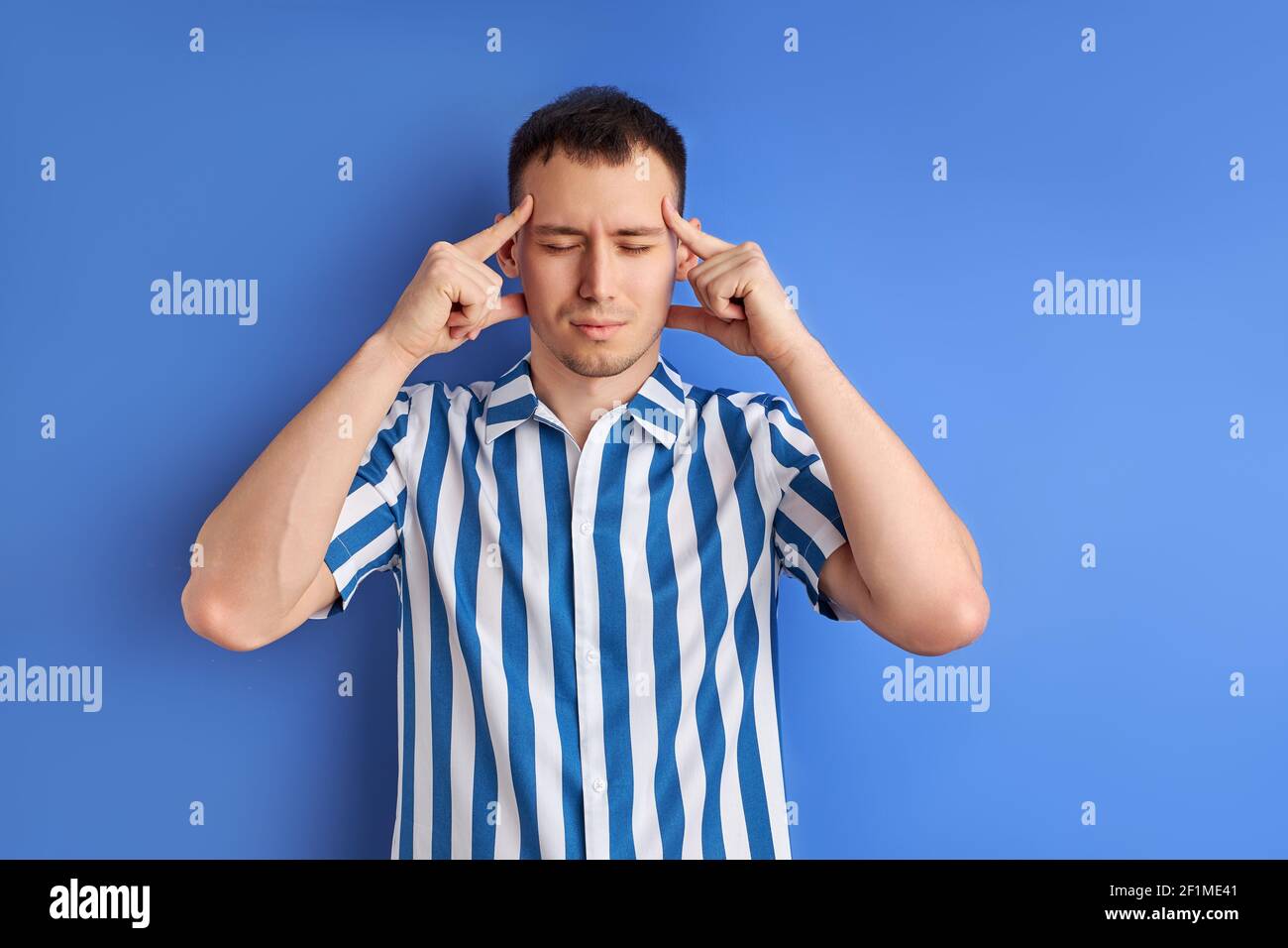 Thinking man isolated on blue background. Pensive male concentrated on ...