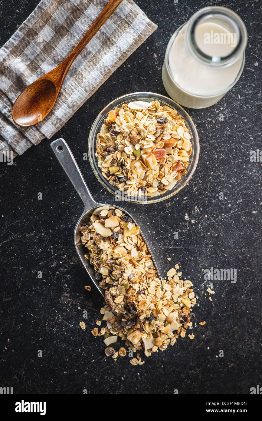 Beakfast cereals in bowl. Healthy muesli with oat flakes, nuts and ...