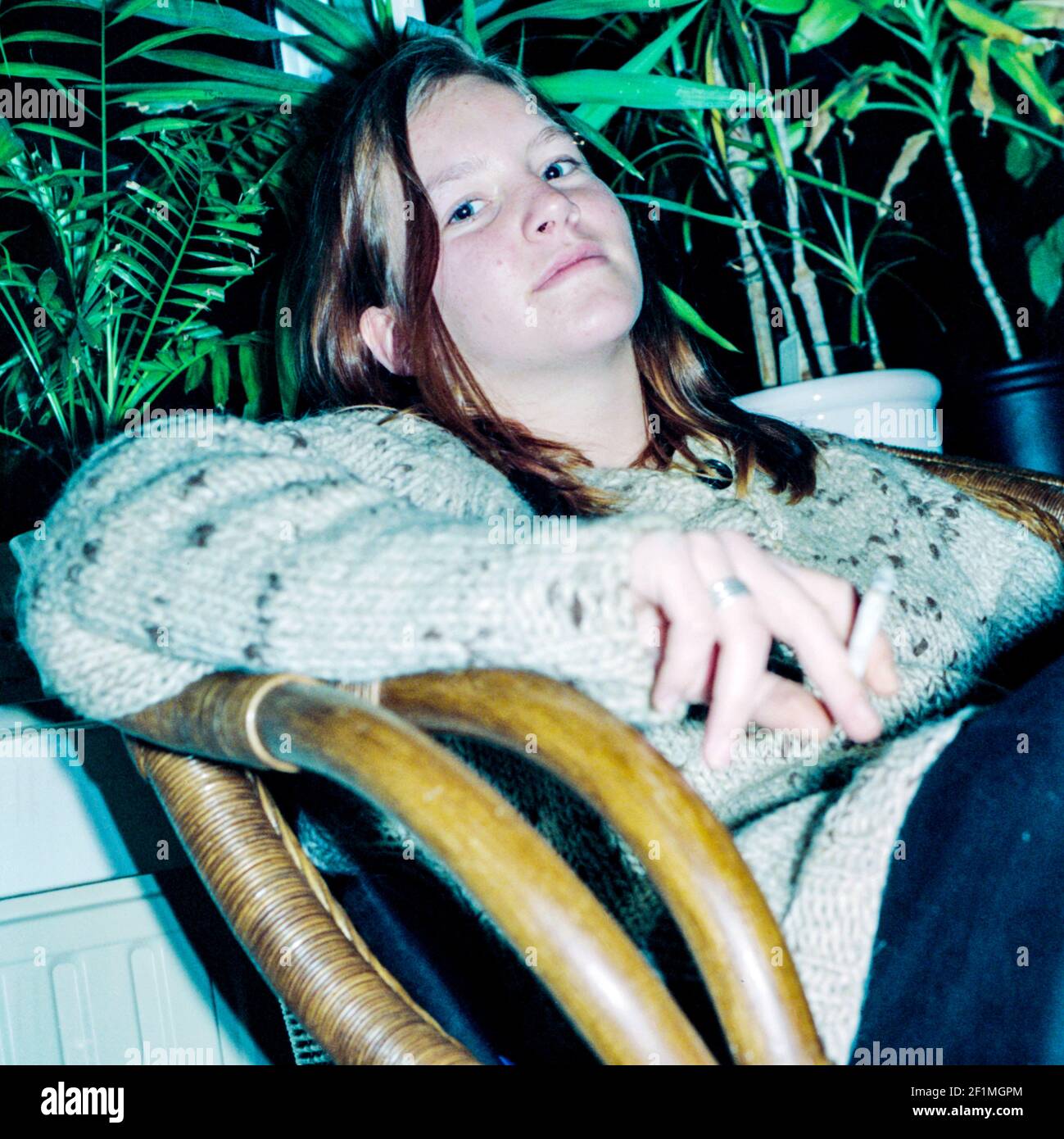 Woman cigarette sitting on chair hi-res stock photography and images ...