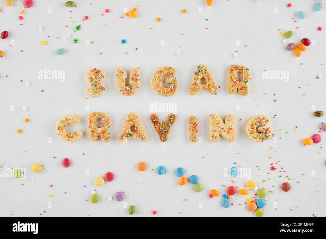 Sugar craving inscription made of biscuit letters and decorated with ...