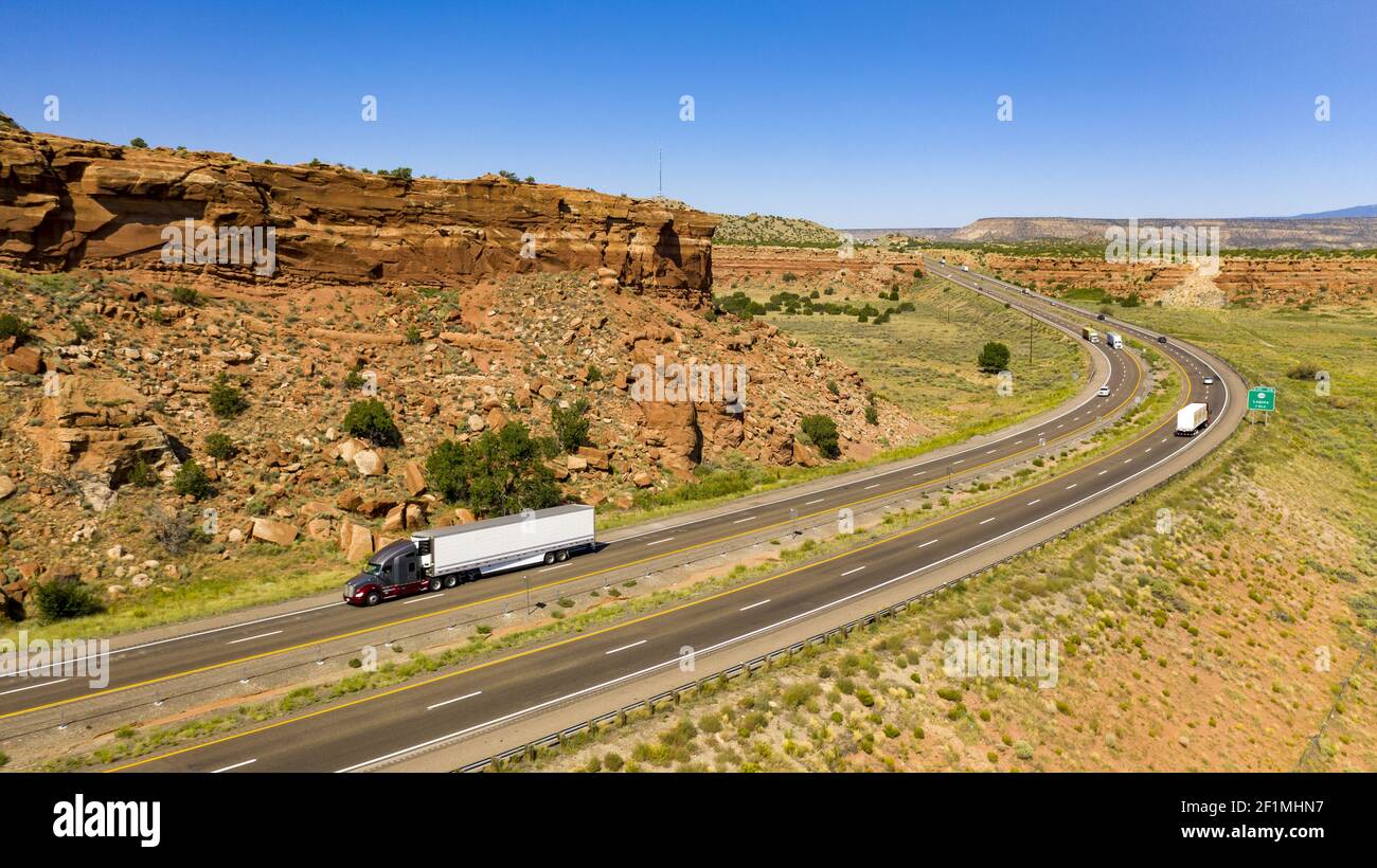 Vehicle Traffic moves along a Divided Highway in southwestern Desert ...