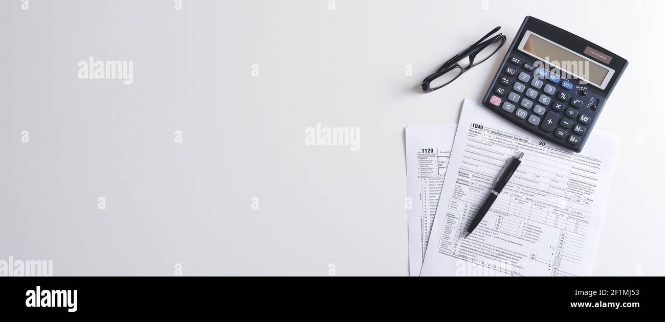 US Individual income tax return. US tax forms on desk. Wide image with ...