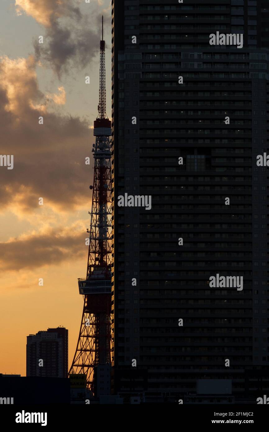 Tokyo Tower behind a high-rise apartment building in Tokyo, Japan Stock ...