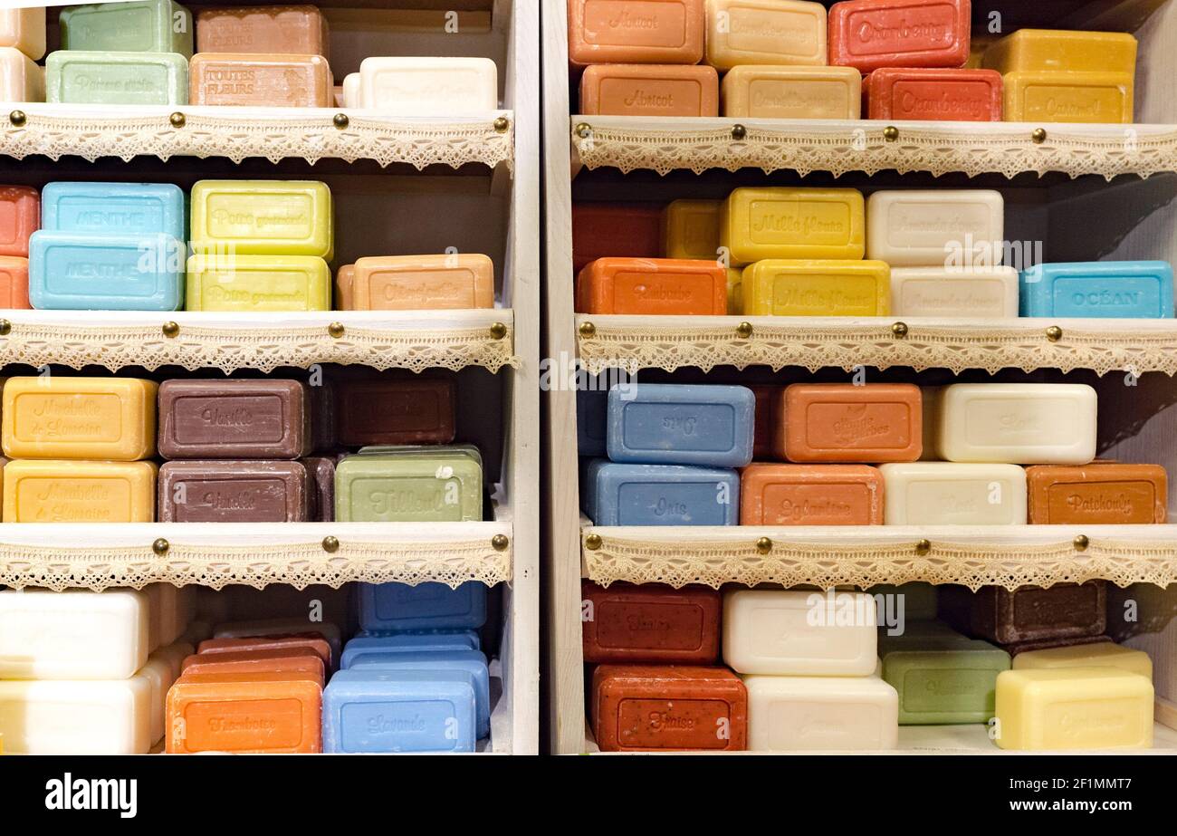 Colorful bars of soap stacked in a wooden cabinet Stock Photo - Alamy
