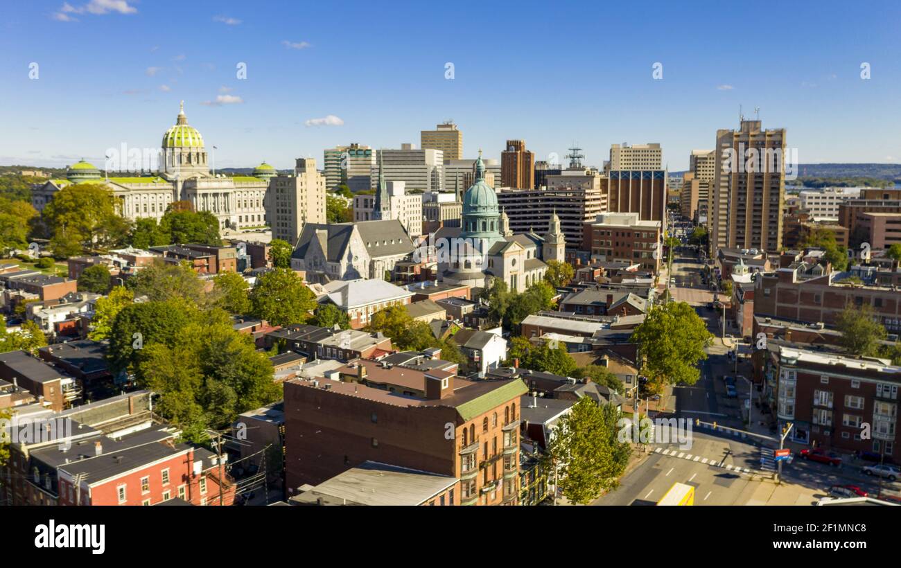 Afternoon light hits the buildings and downtown city center area in ...