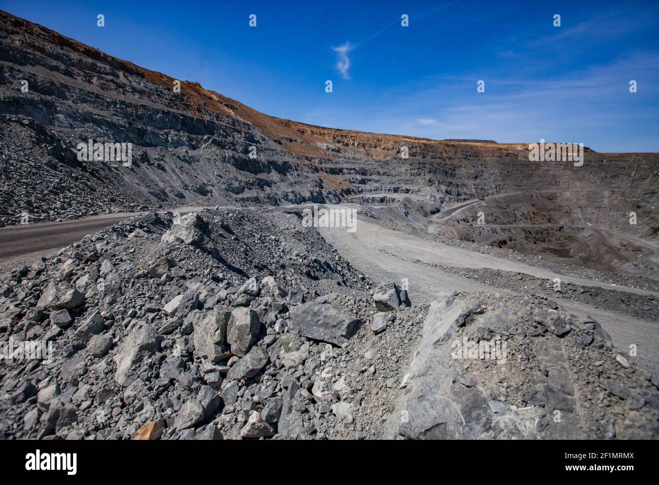 Copper ore open-pit mining. Panorama of quarry. Grey rocks and gravel ...