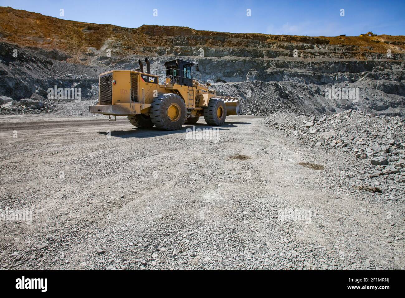 Metal ore with caterpillar excavator hi-res stock photography and ...