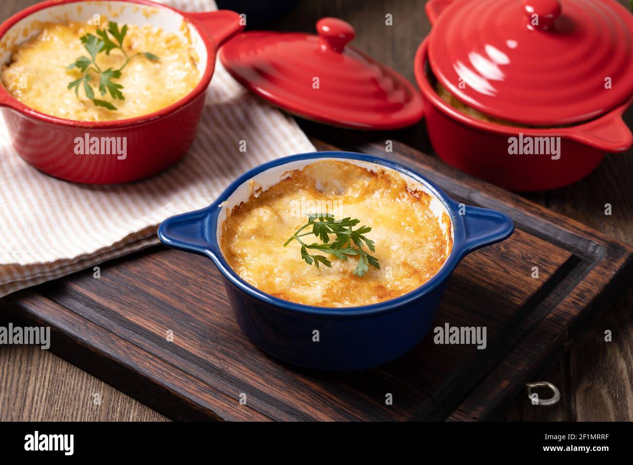 Stew pot with sausage and cheese Stock Photo - Alamy