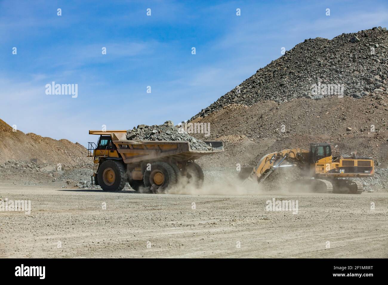 Metal ore with caterpillar excavator hi-res stock photography and ...