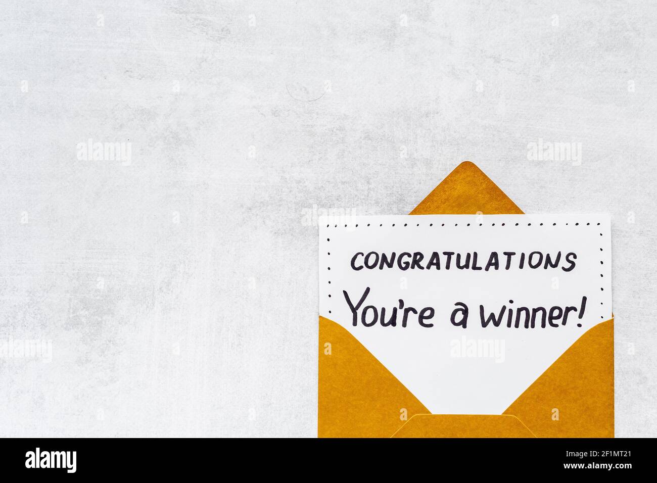 Congratulations award concept -You are a winner card in golden envelope ...