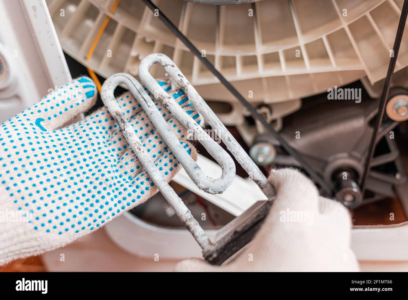 Worker holds broken heating hi-res stock photography and images - Alamy