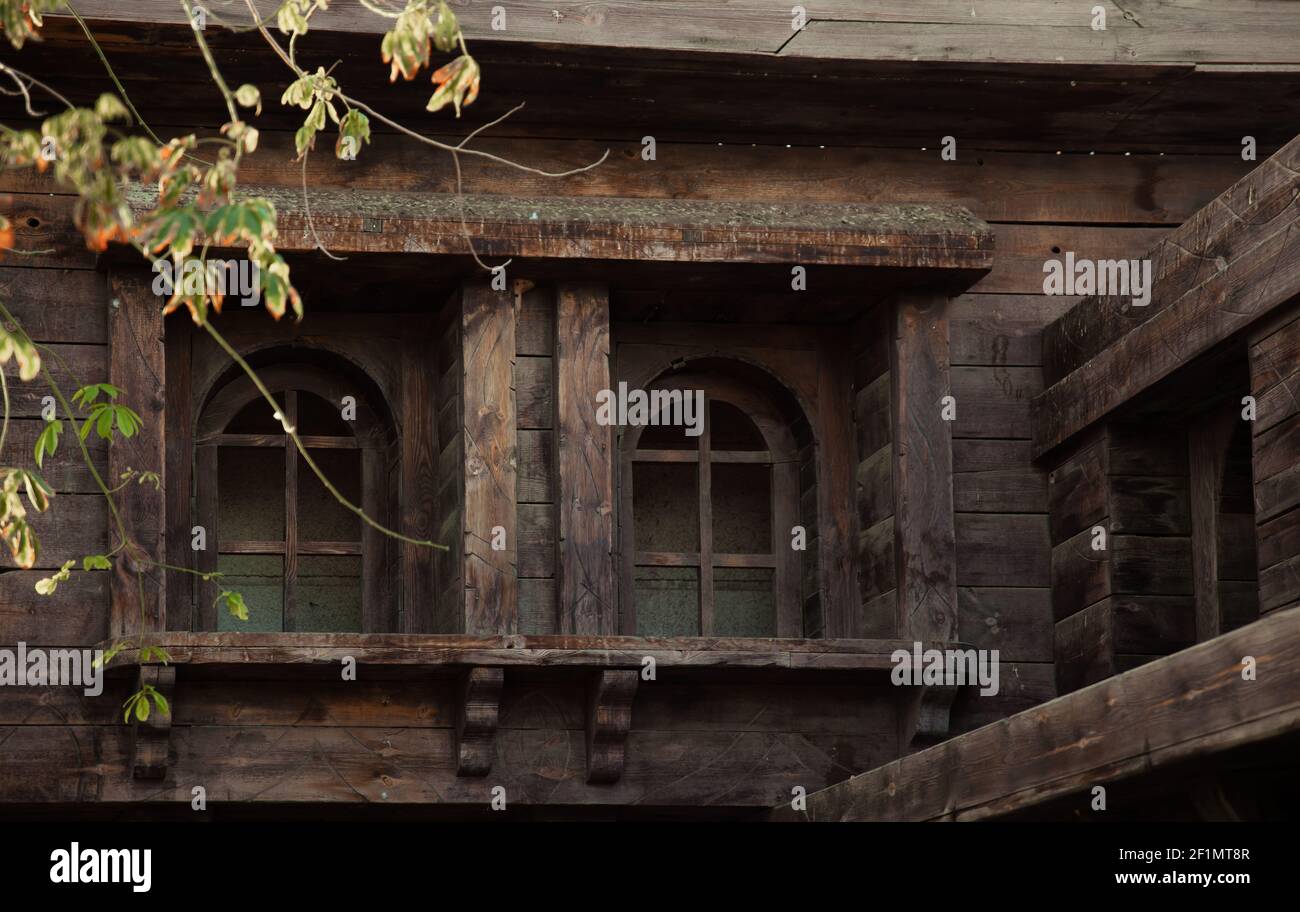 Old abandoned wooden house with wooden windows and shutters Stock Photo - Alamy