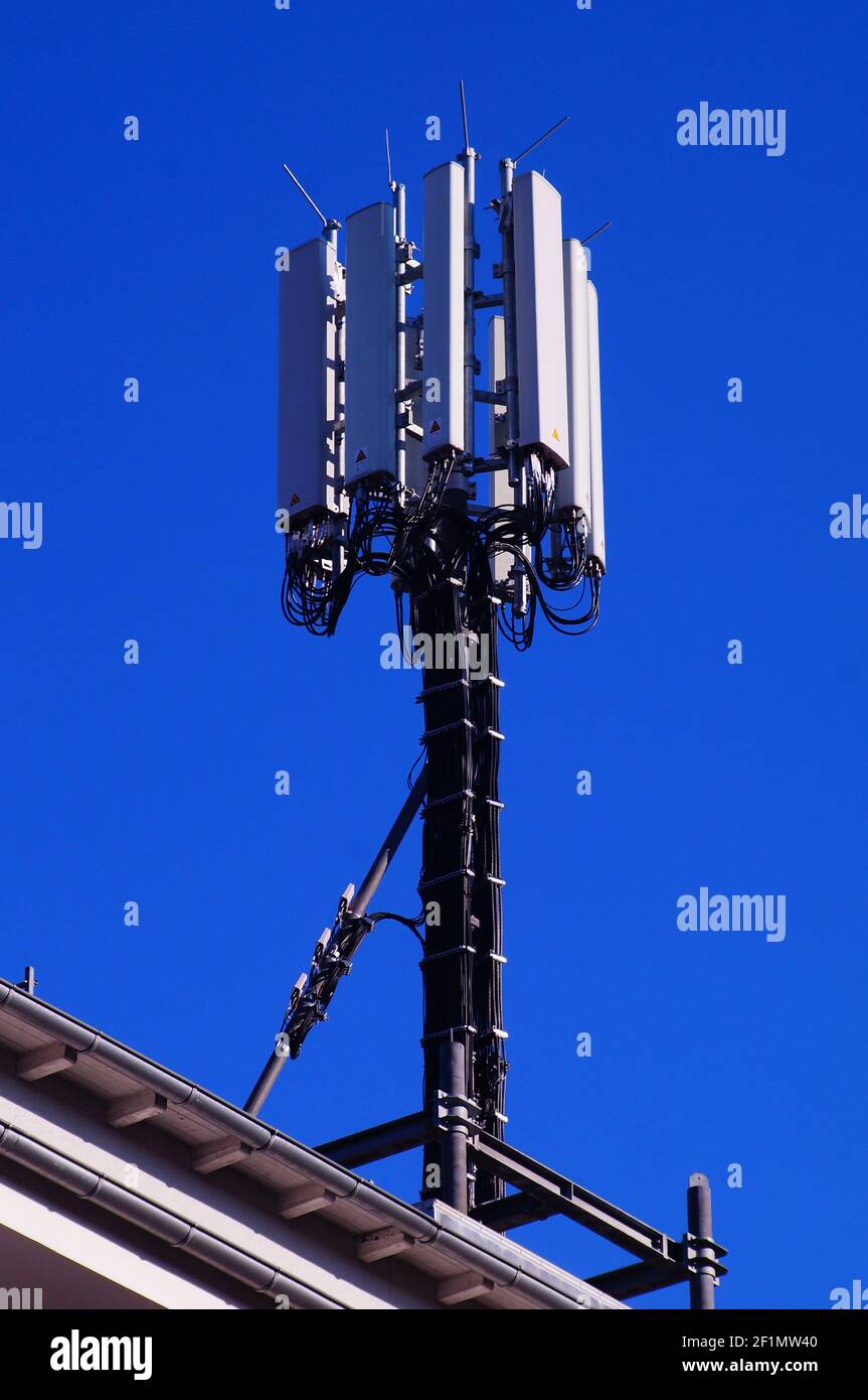 Cell phone masts on a house roof in Frankfurt, Germany Stock Photo - Alamy