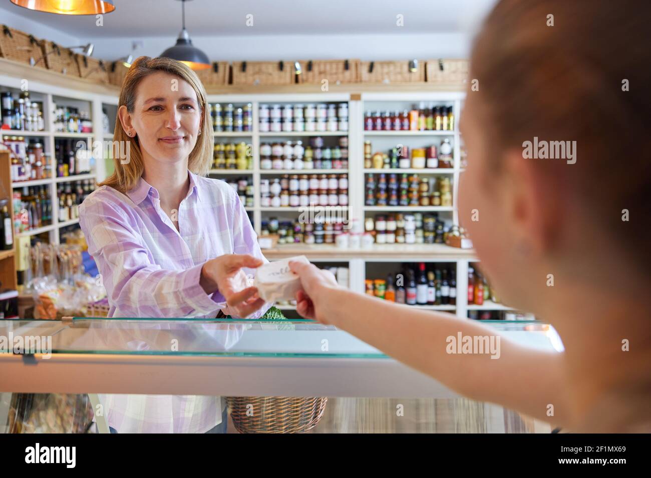 Woman with shop assistant hi-res stock photography and images - Alamy