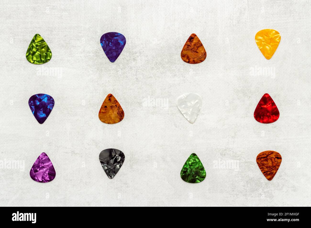Guitar picks pattern. top view. Music background Stock Photo - Alamy