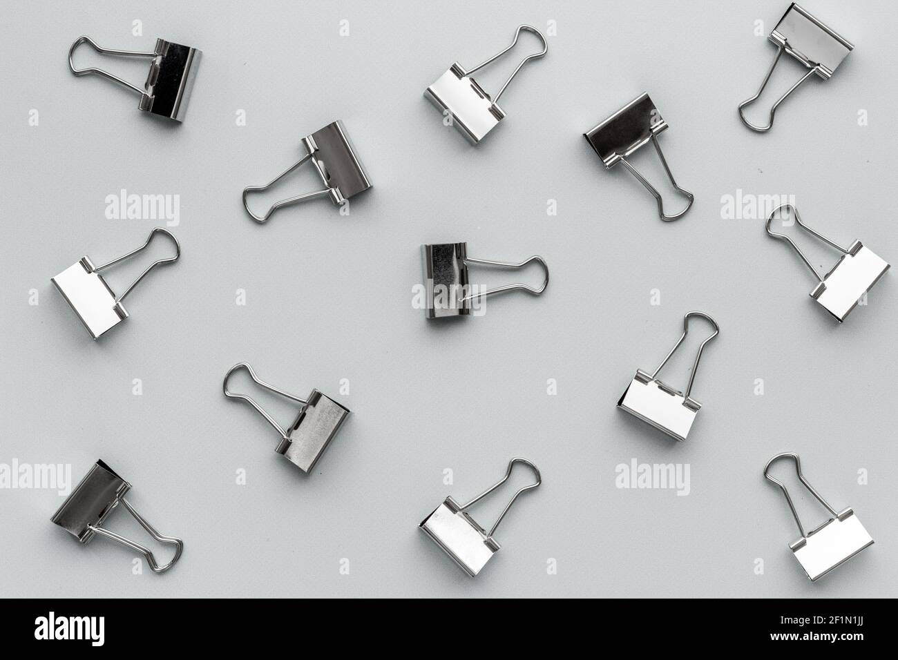 Office supplies background - paper binder clips top view Stock Photo ...