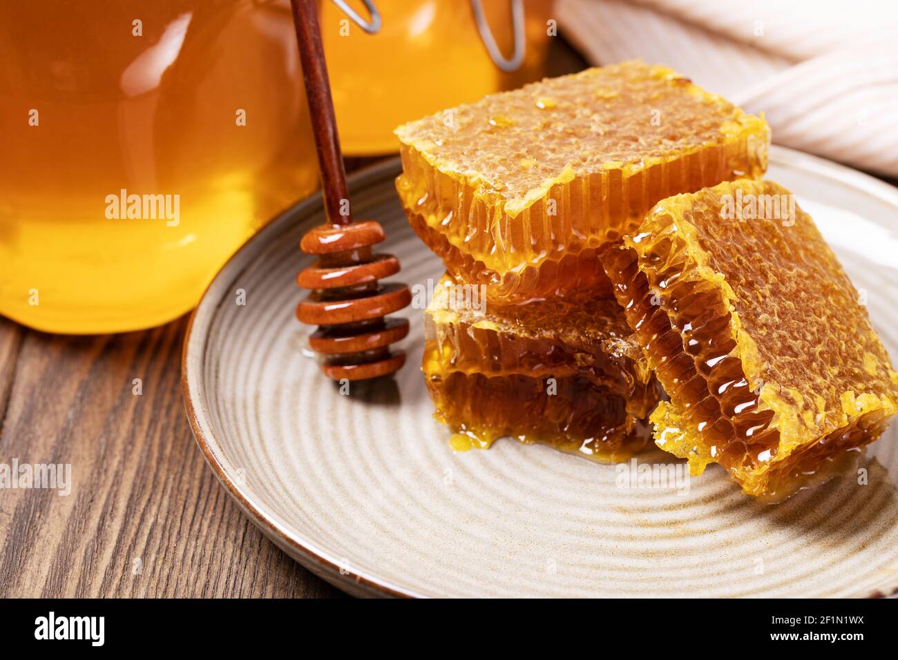Honey and Honeycomb slice Stock Photo - Alamy