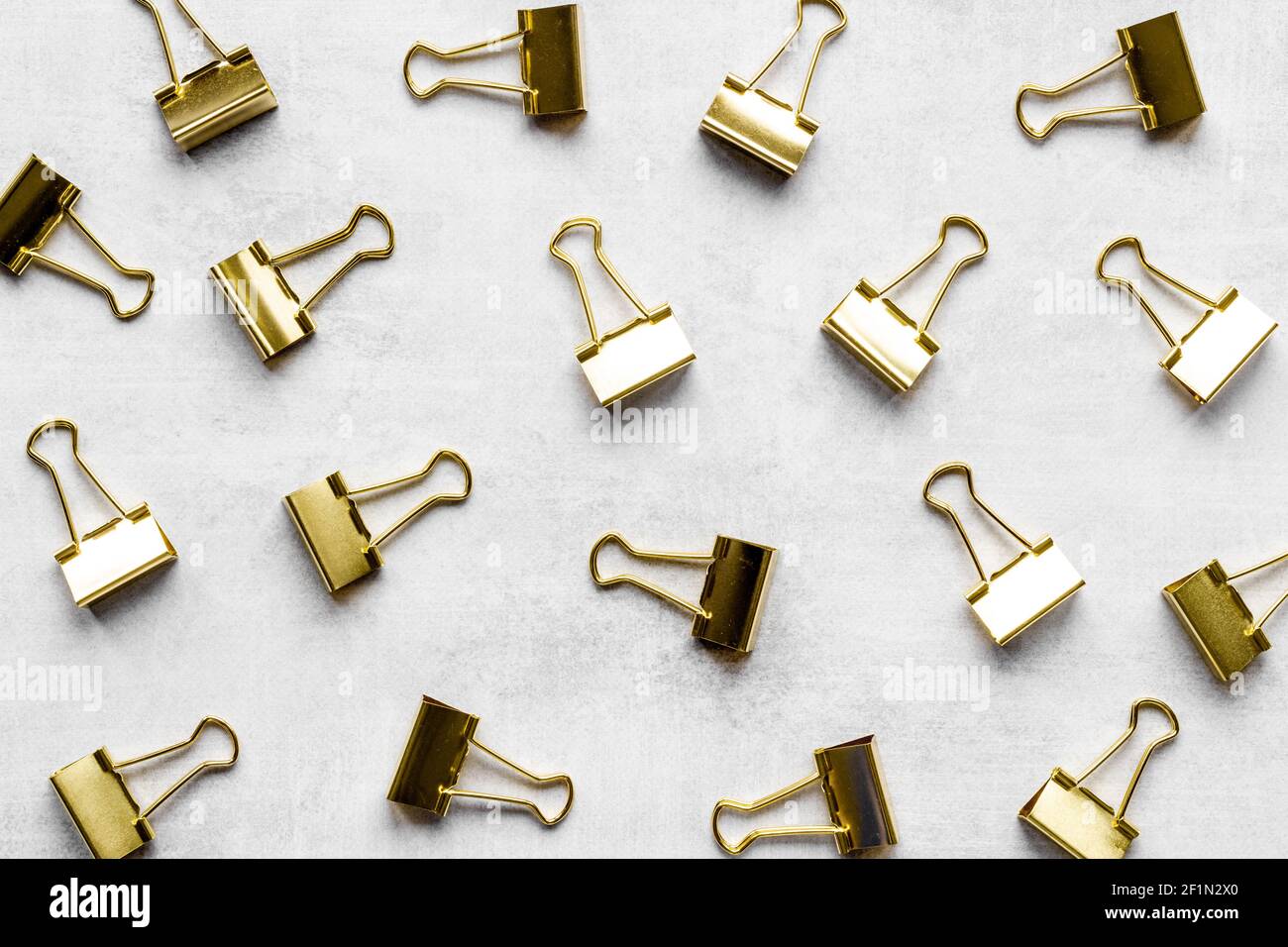 Stationery pattern. Paper binder clips top view Stock Photo - Alamy