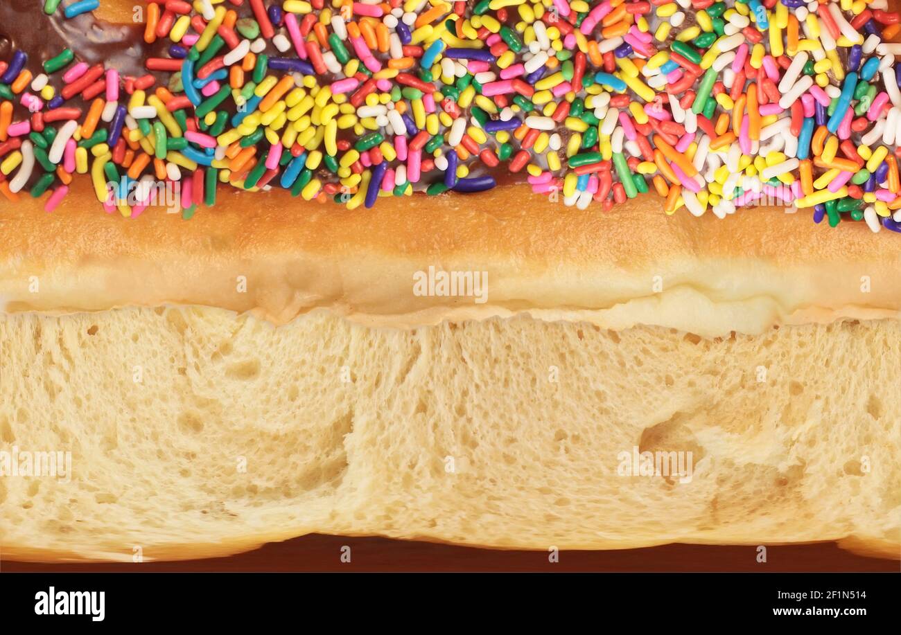 Flat texture of chopped donut with colorfull sprikles on chocolate ...