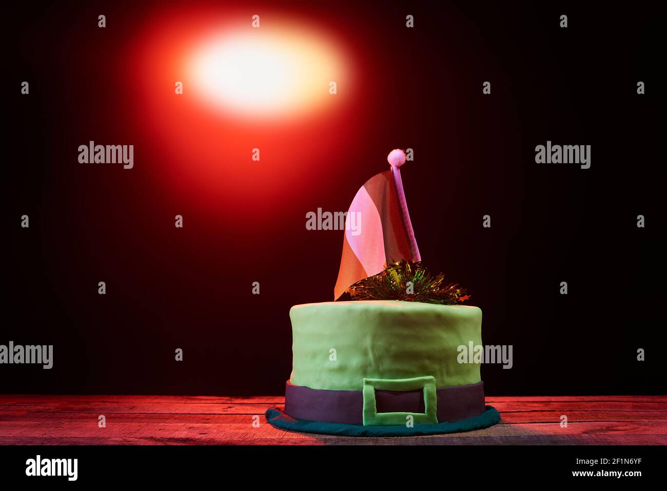 green frosting cake shaped like a green hat with an Irish flag on top ...