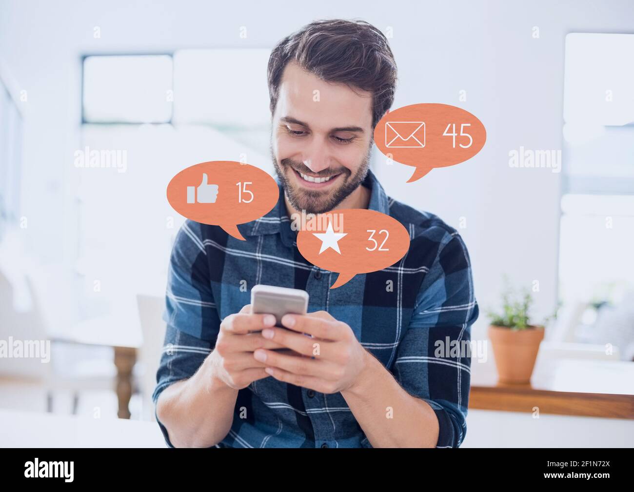 Social media icons on speech bubbles against caucasian man using ...