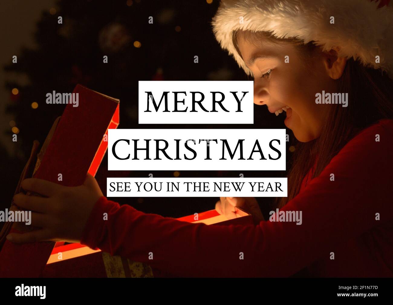 Merry christmas see you in the new year text over happy girl opening ...