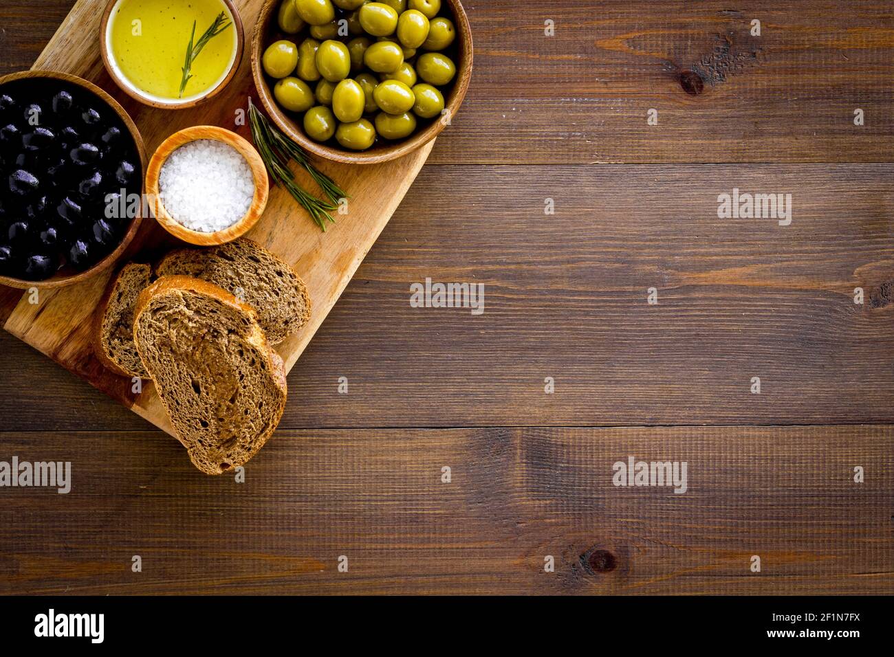 Italian food background with olives oil and sliced bread. Top view ...