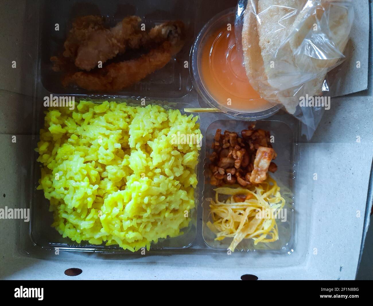 Indonesian ramadan rice lunch box called Aneka Nasi Kotak. An iftar ...
