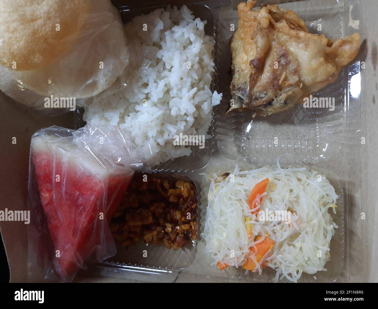 Indonesian ramadan rice lunch box called Aneka Nasi Kotak. An iftar ...