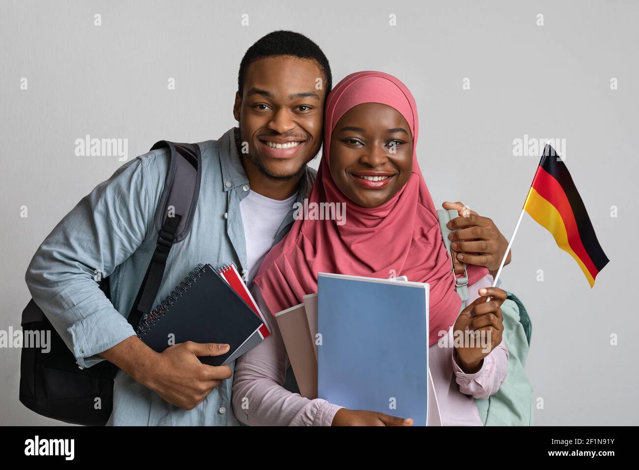 Happy african american muslim students young man and woman in hijab ...