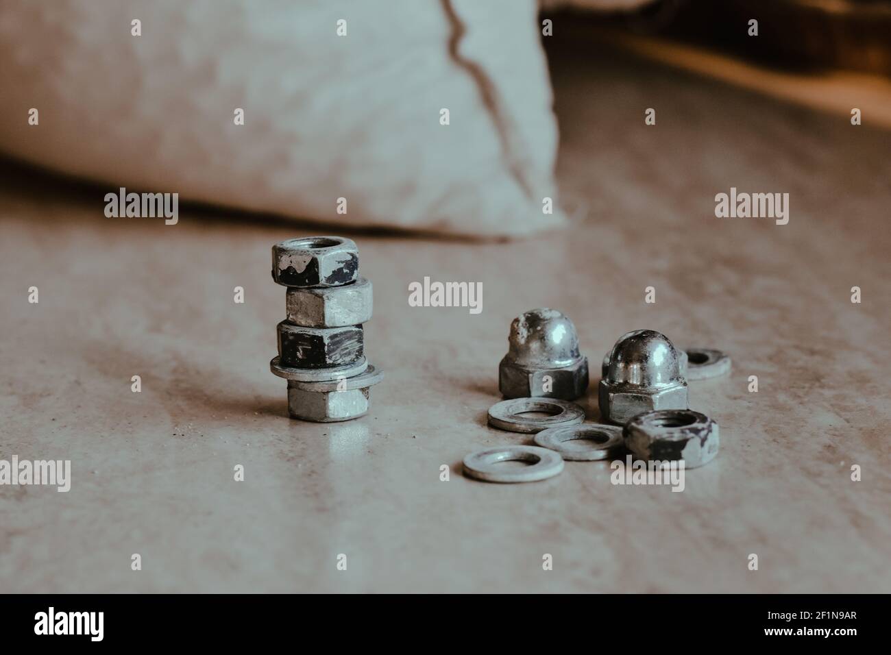 A selective focus shot of joint nuts on a wooden surface Stock Photo - Alamy