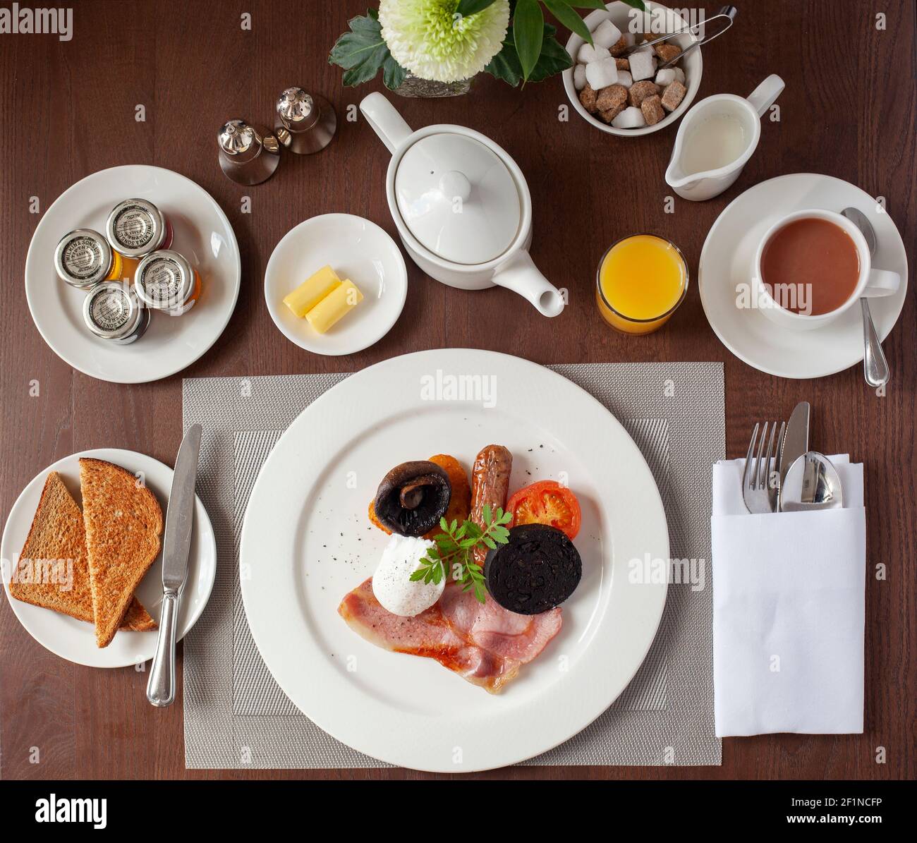 A full English breakfast at a hotel restaurant with toast and tea Stock ...