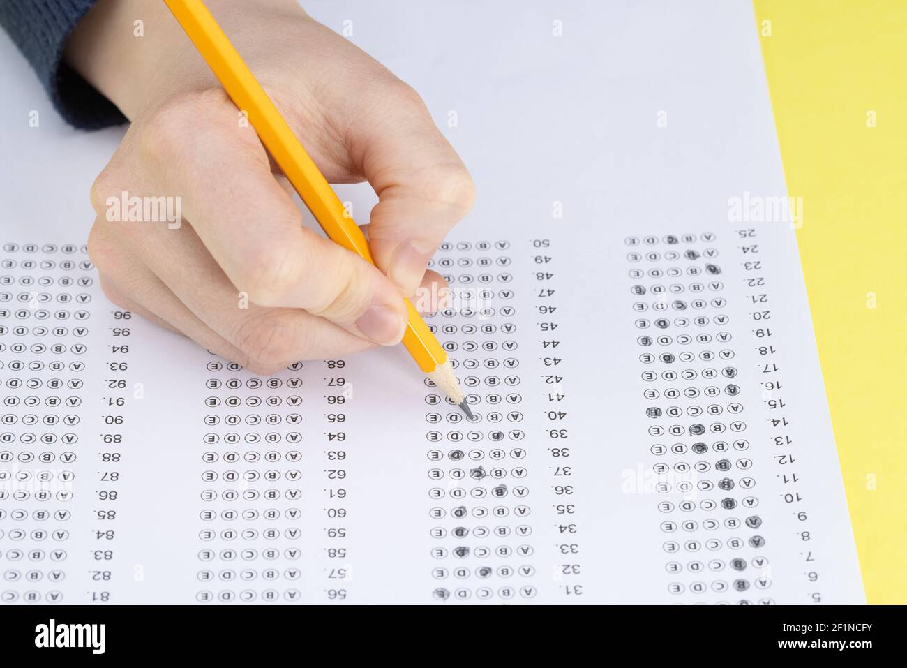 Exam. Filling in the test with a pencil Stock Photo - Alamy