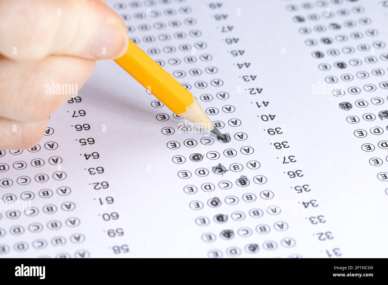 Exam. Filling in the test with a pencil Stock Photo - Alamy
