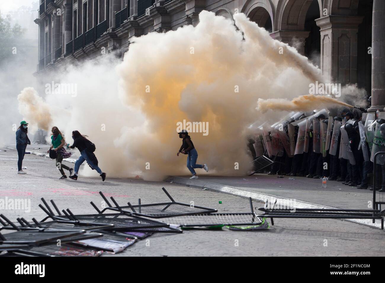 Mexico City, Mexico, March 8, 2021, A women confront a police line ...
