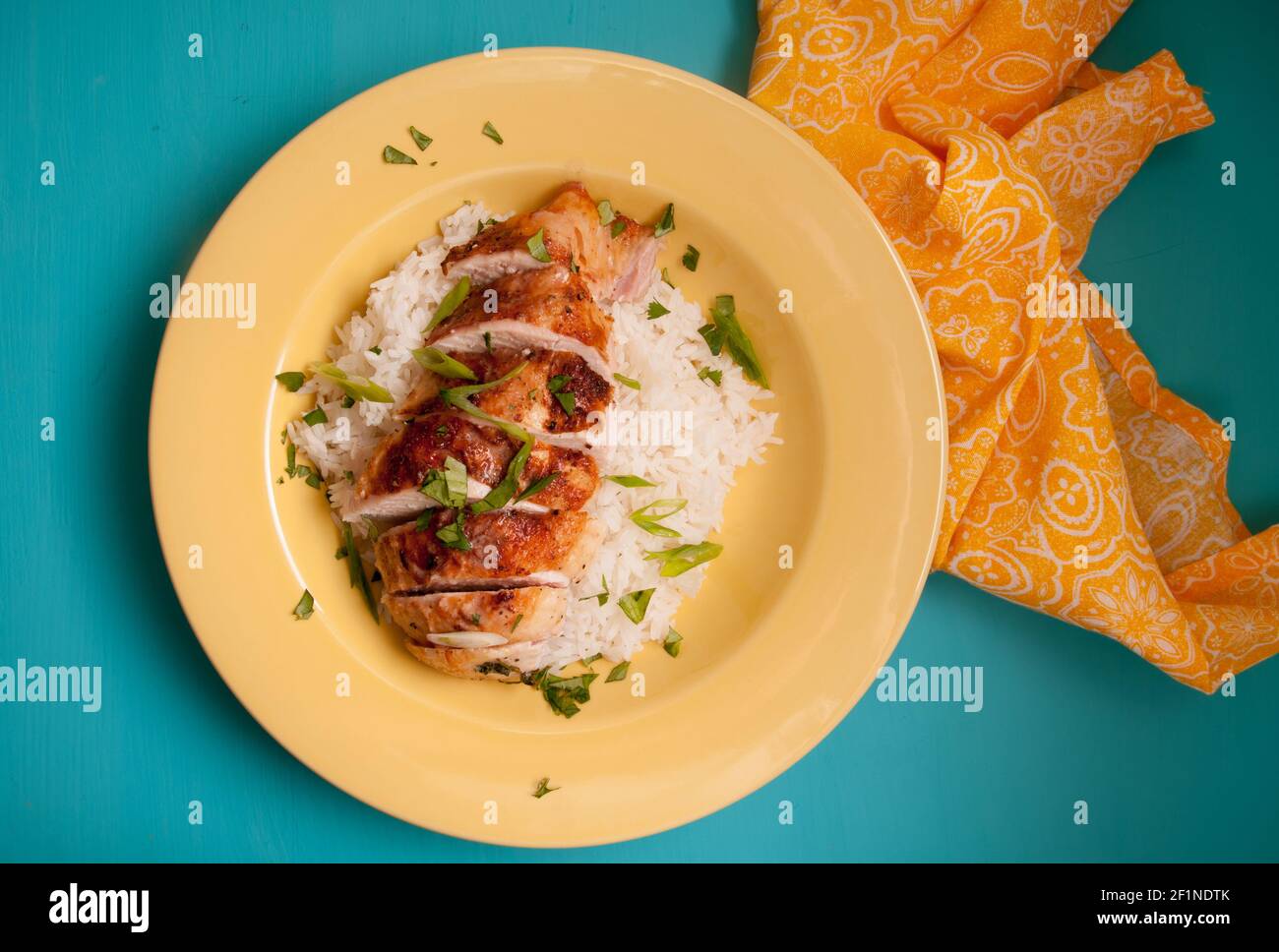 coconut chicken with crispy skin, white rice and onion Stock Photo - Alamy