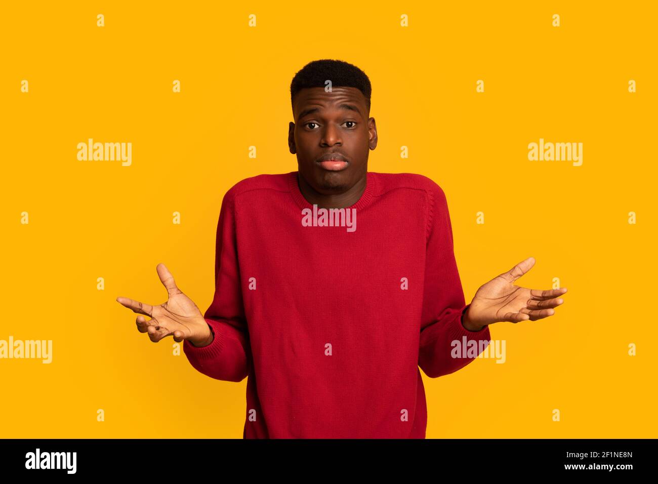 I Don't Know. Doubtful African American Guy Shrugging Shoulders And ...