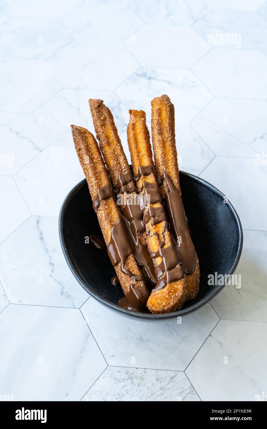 Churros Sticks with Chocolate Sauce . Fried Dough Pastry Traditional ...