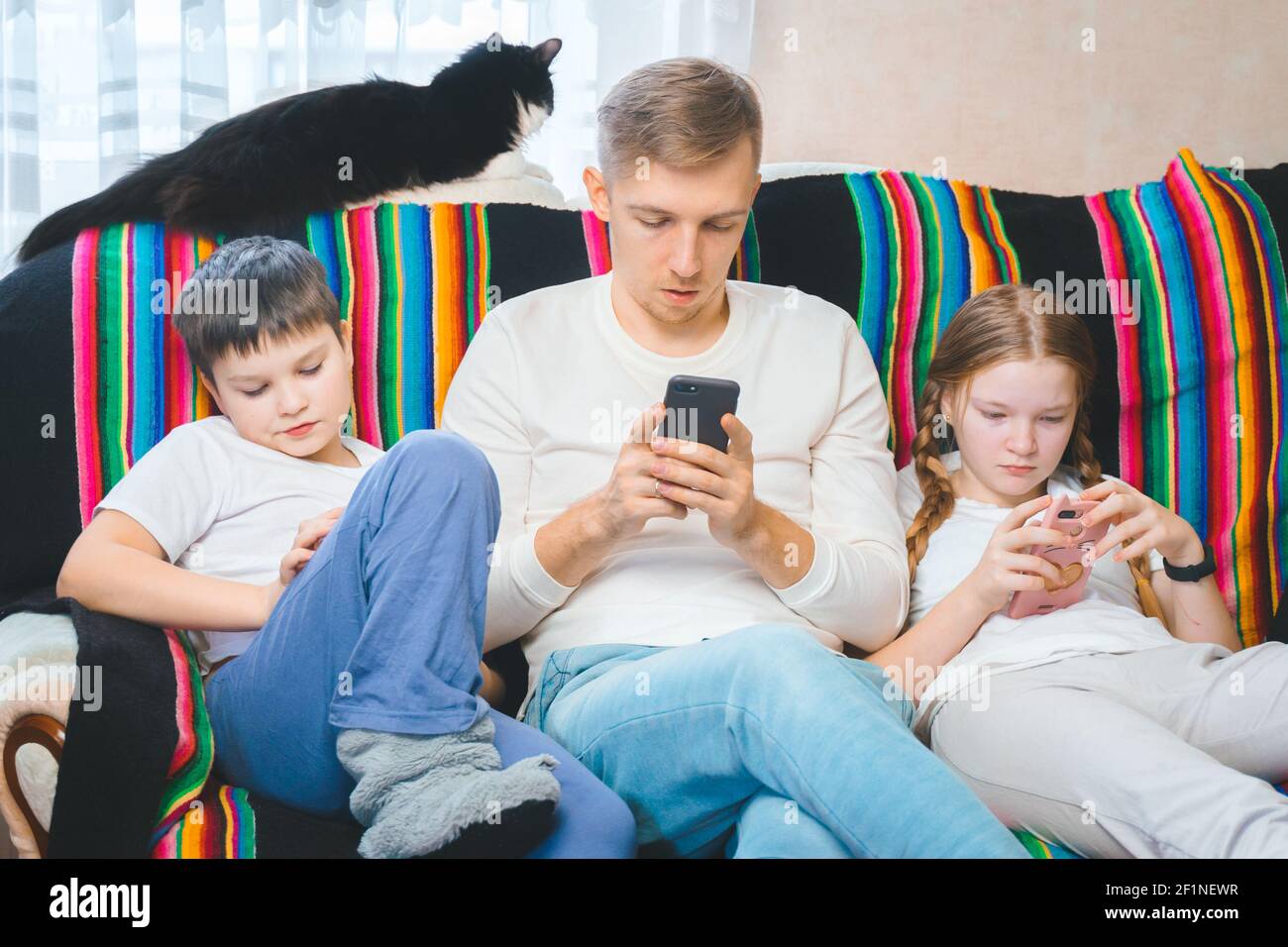 Parents watching kids on phone hi-res stock photography and images - Alamy