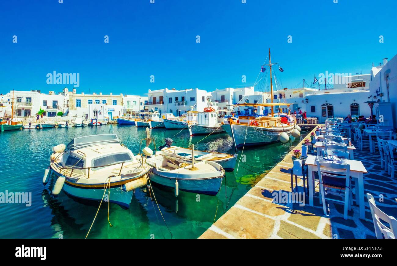 Parked boats in the harbor, near cafe at Paros, Greece Stock Photo - Alamy