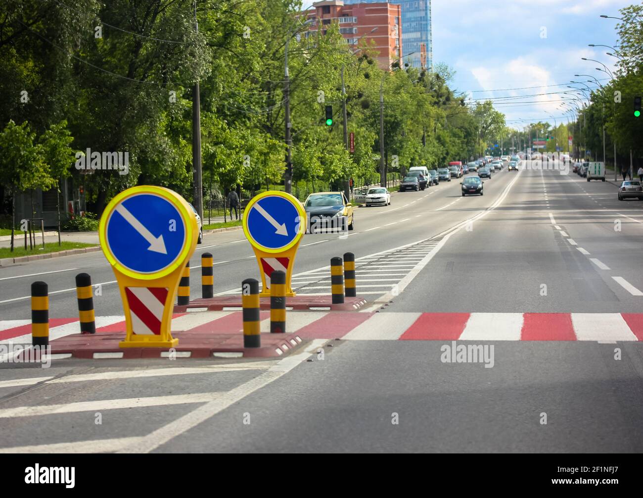 Crosswalk in the city in summertime, striped red and white markings on ...