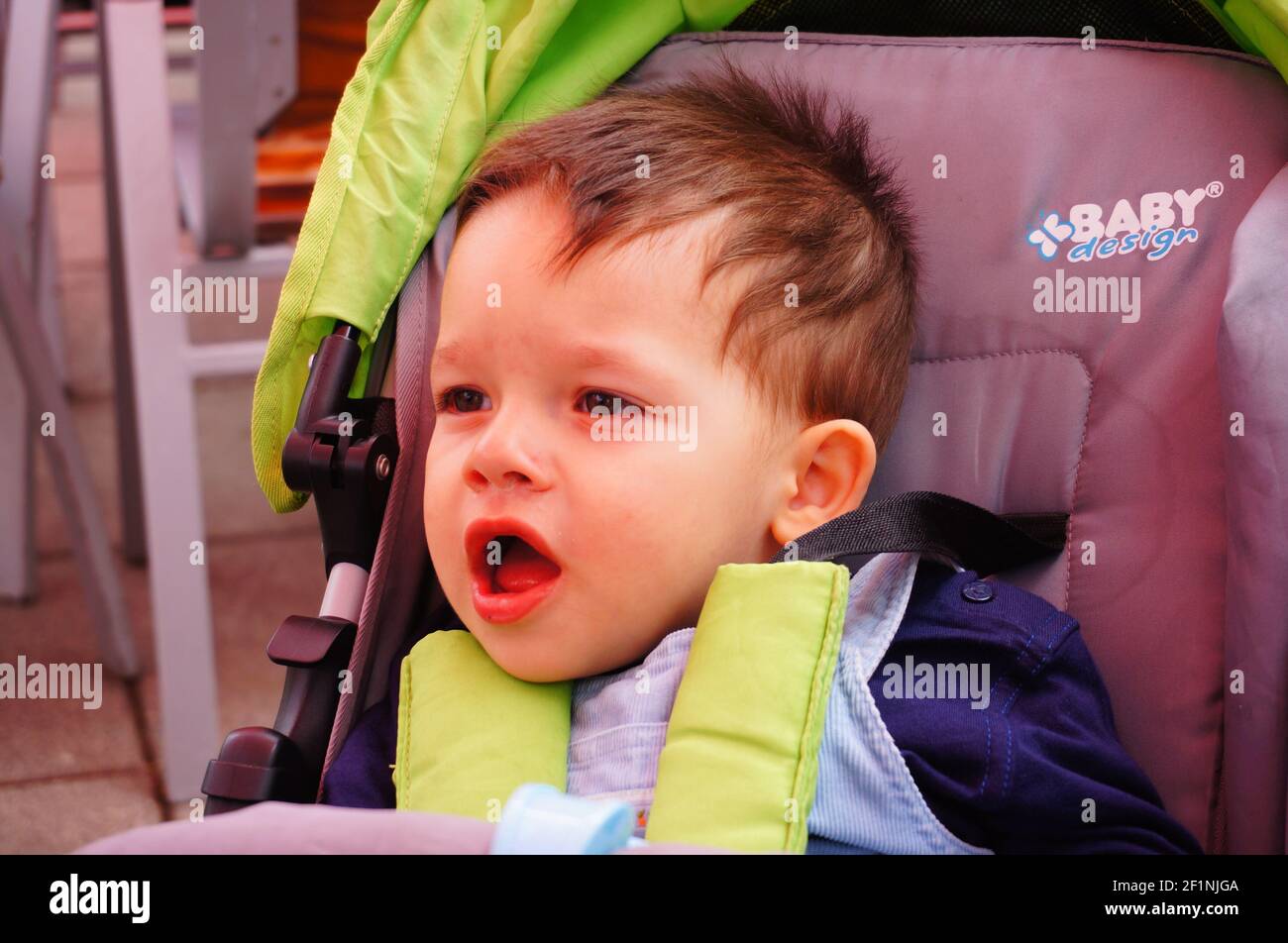 Child sitting in the buggy hi-res stock photography and images - Alamy