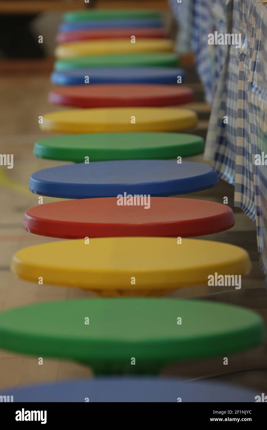 Colourful seats in school Stock Photo - Alamy