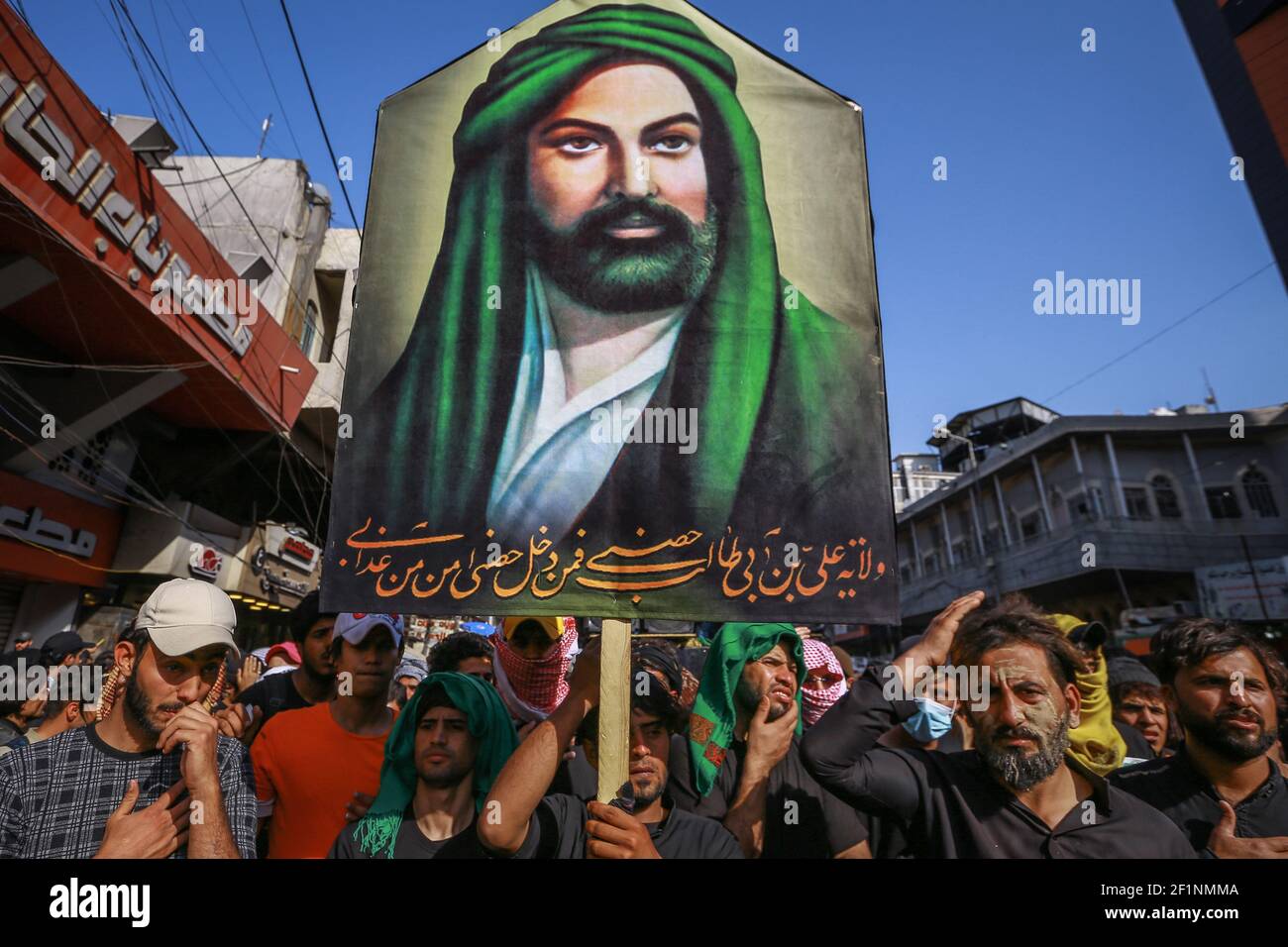 Bagdad, Iraq. 09th Mar, 2021. Iraqi Shiite Muslims take part in a ...
